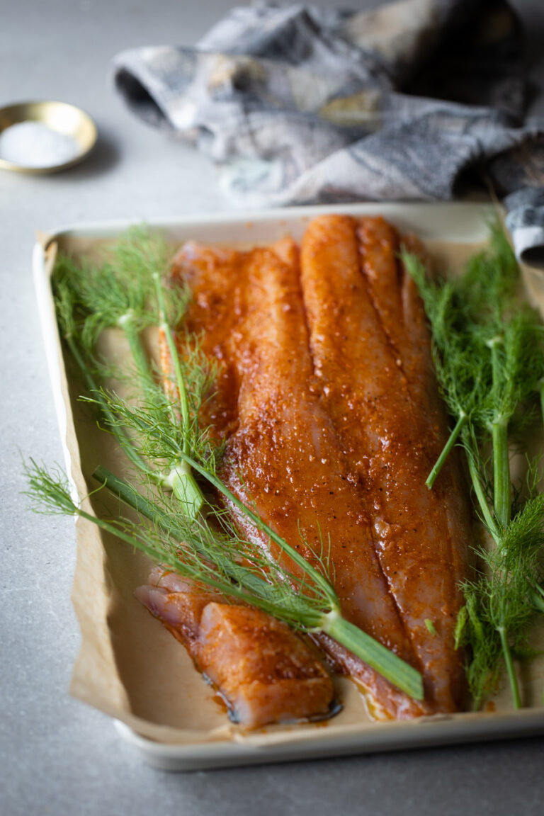 Baked spiced yellowtail with roasted fennel, tomatoes and red pepper